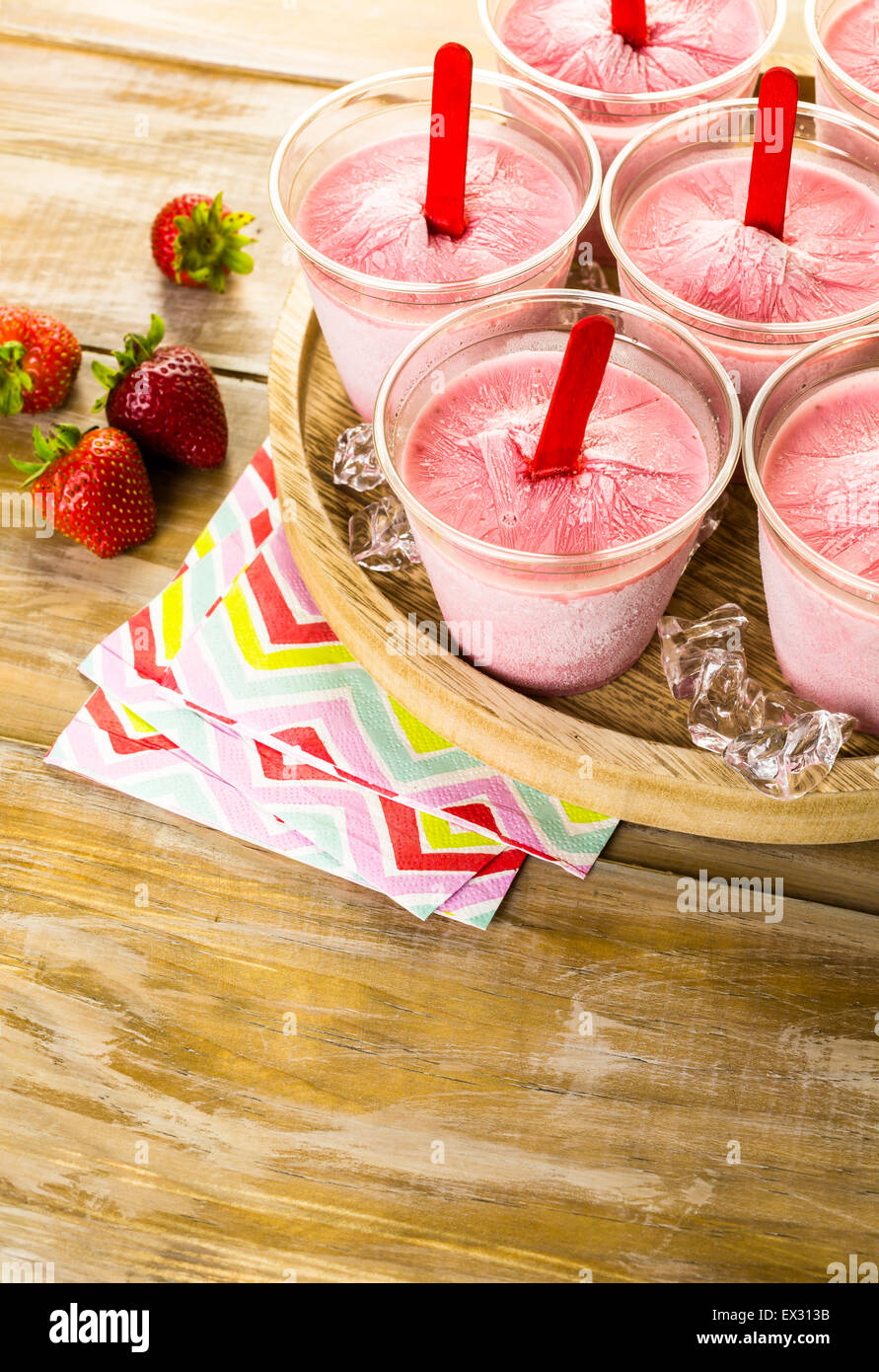 Homemade strawberry popsicles made in plastic cups Stock Photo - Alamy