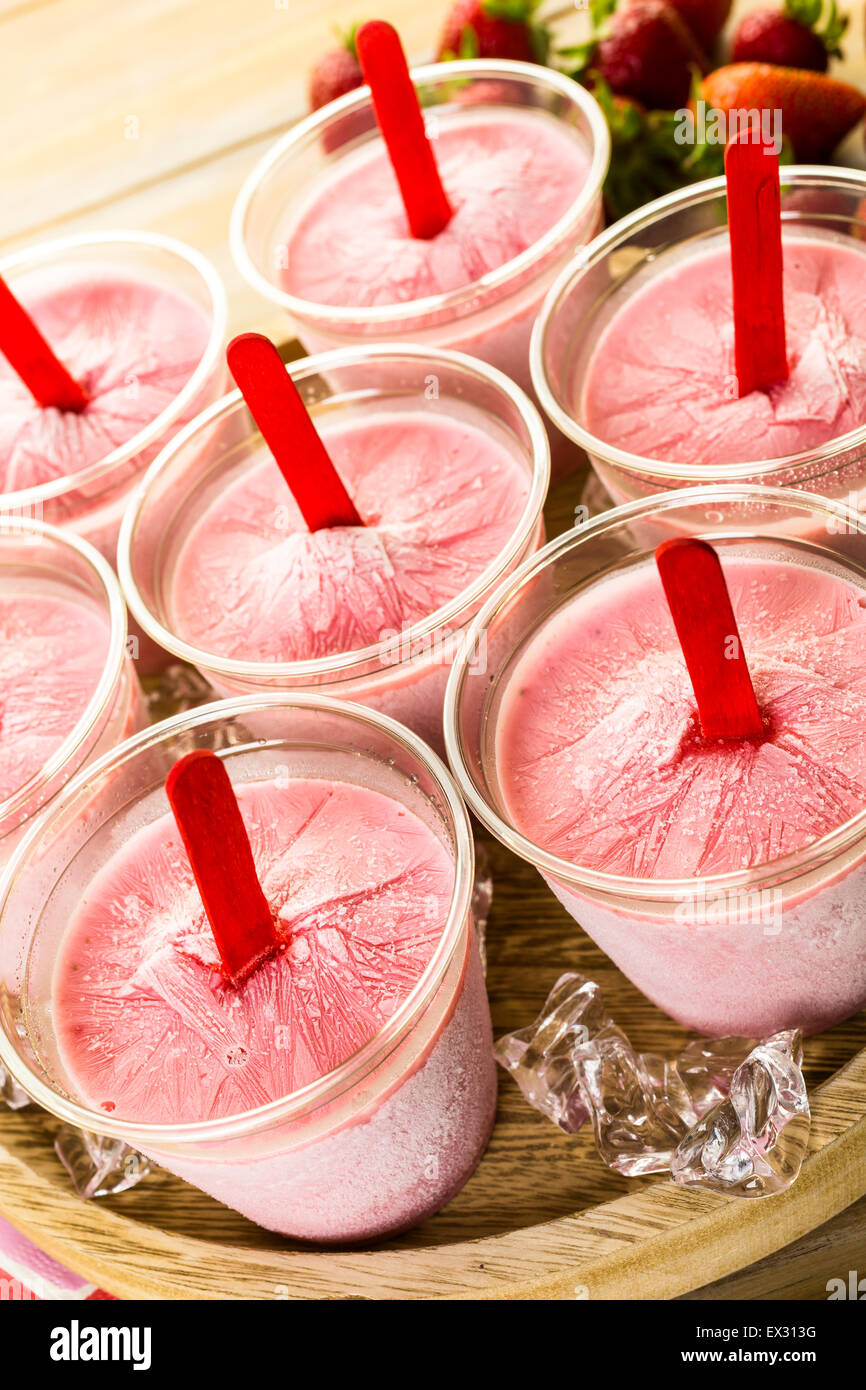 Homemade strawberry popsicles made in plastic cups Stock Photo - Alamy