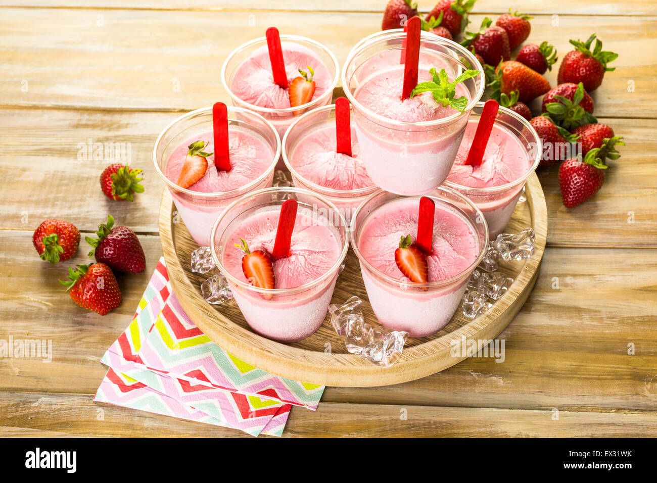 Homemade strawberry popsicles made in plastic cups Stock Photo - Alamy