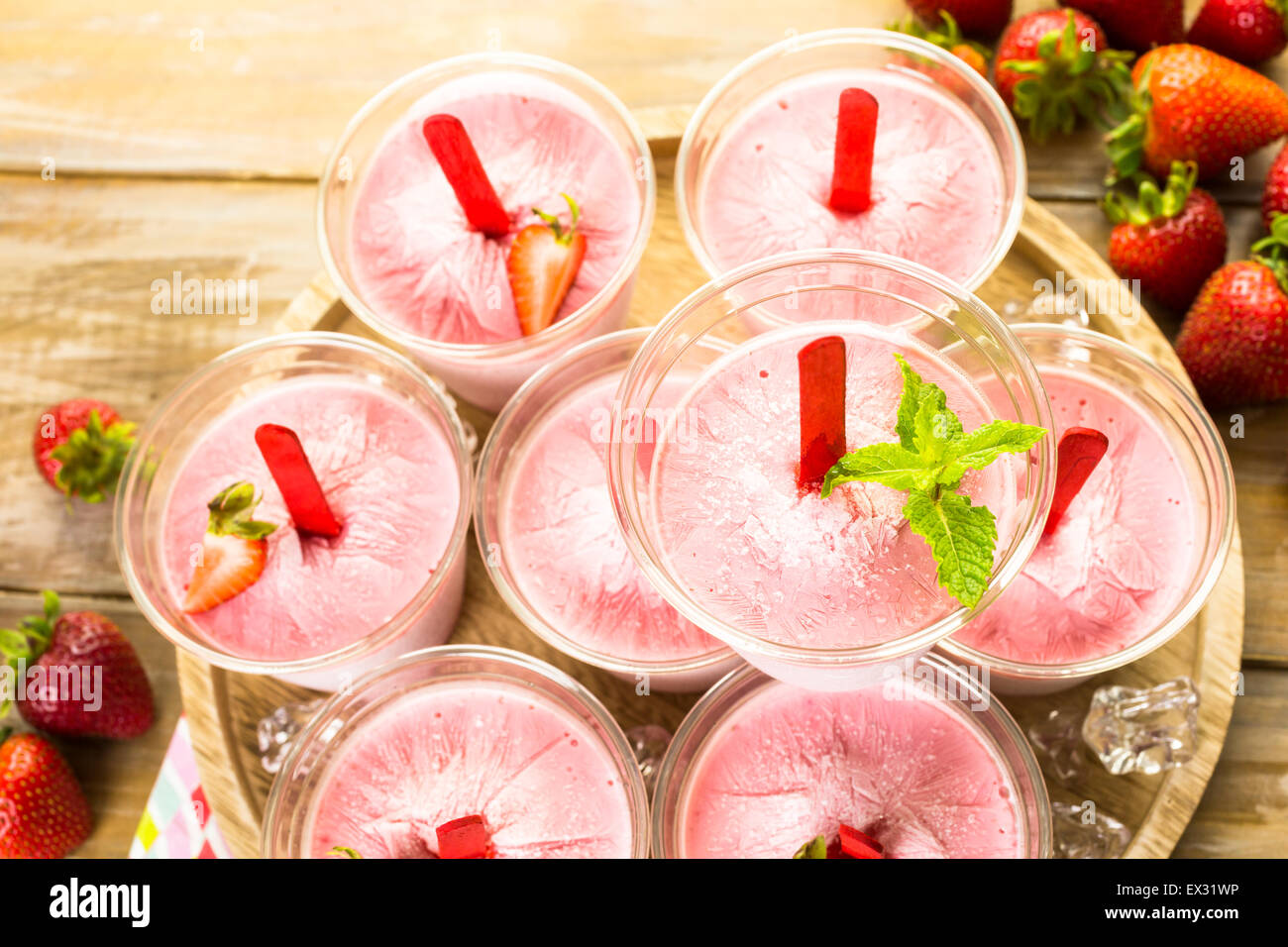 Homemade strawberry popsicles made in plastic cups Stock Photo - Alamy