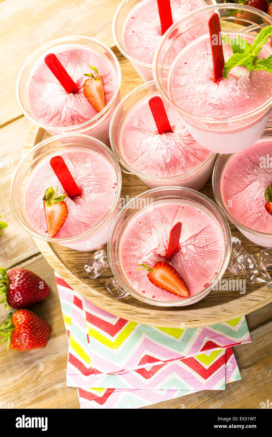 Homemade strawberry popsicles made in plastic cups Stock Photo - Alamy