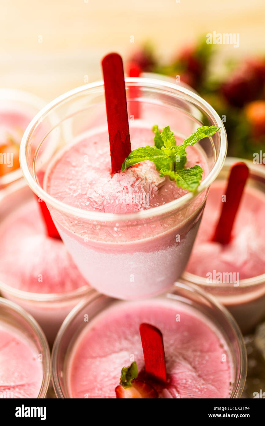 Homemade strawberry popsicles made in plastic cups Stock Photo - Alamy