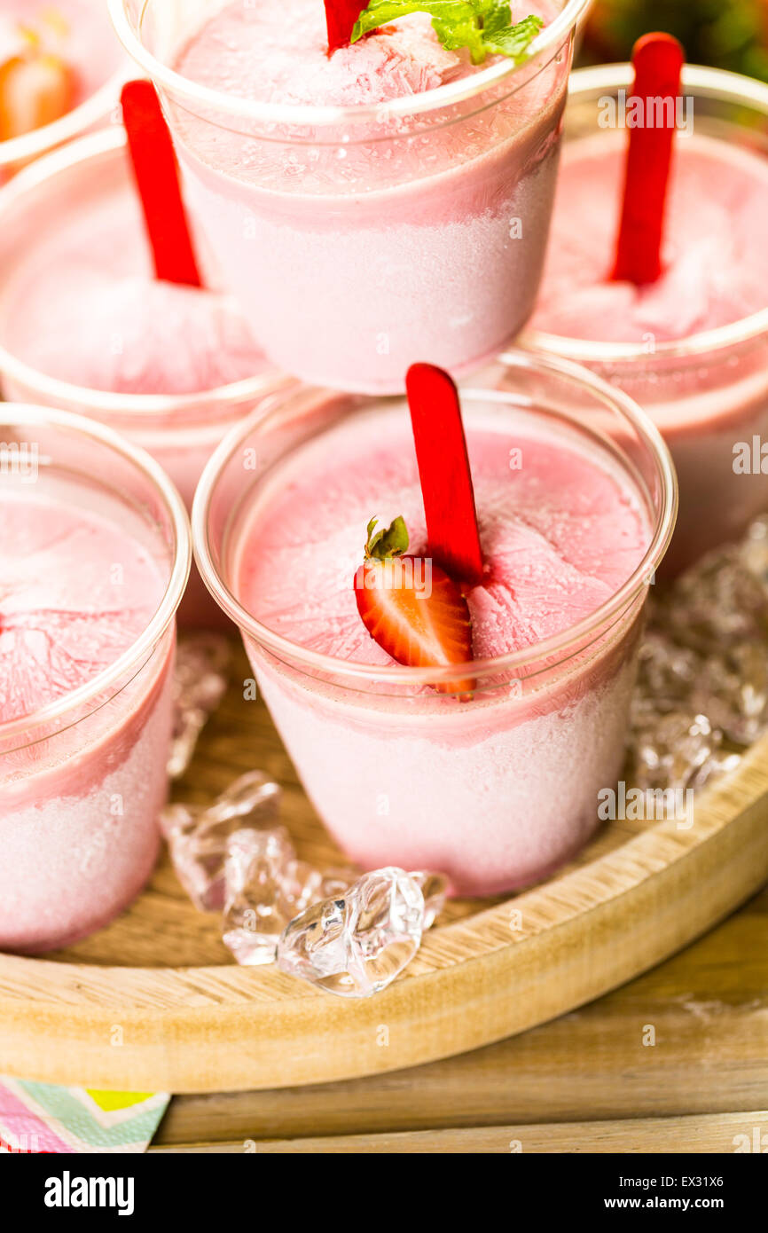 Homemade strawberry popsicles made in plastic cups Stock Photo - Alamy