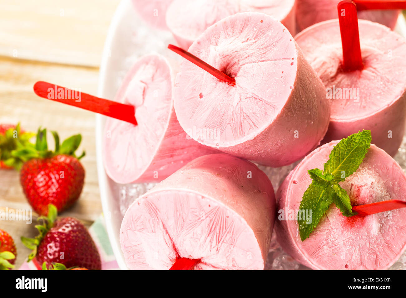 Homemade strawberry popsicles made in plastic cups Stock Photo - Alamy