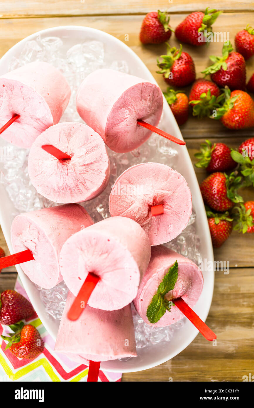 Homemade strawberry popsicles made in plastic cups Stock Photo - Alamy