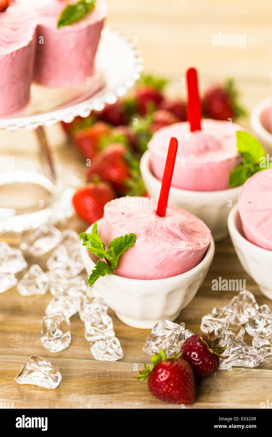 Homemade strawberry popsicles made in plastic cups Stock Photo - Alamy