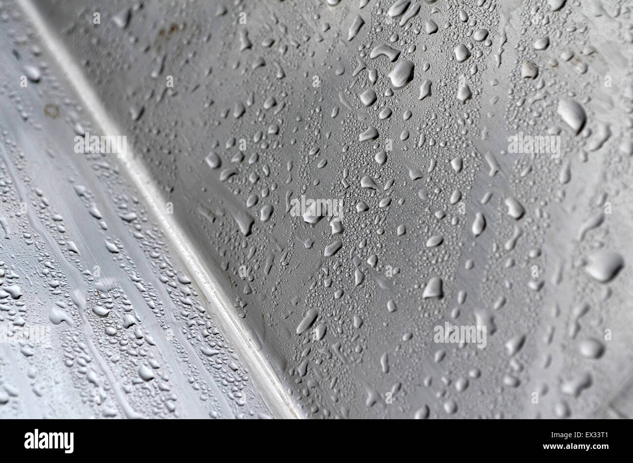 Detail of rain water on the stainless steel chute in Dalmuir park ...