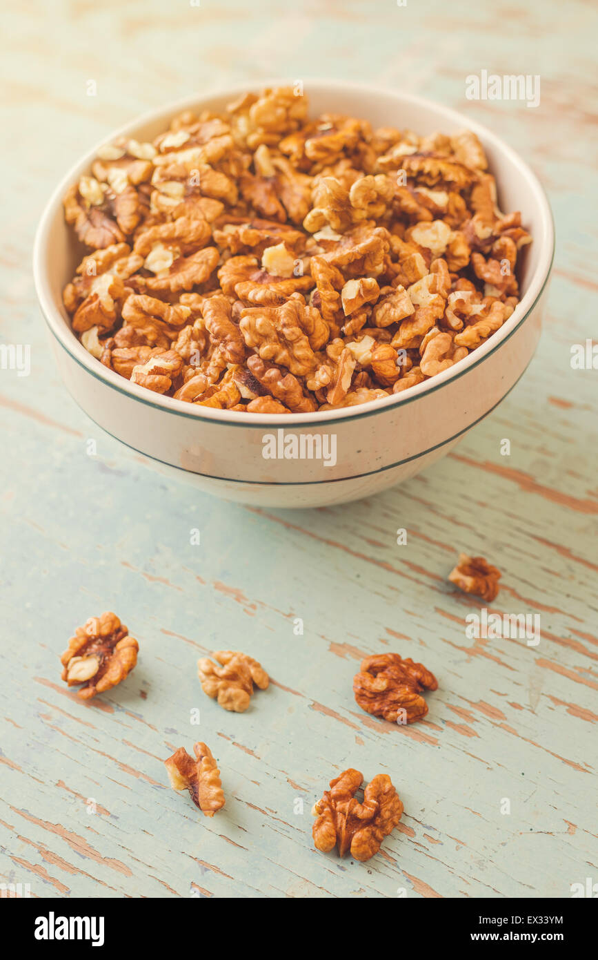 Peeled Walnut Kernels in Ceramic Bowl on Blue Rustic Wood Plank ...