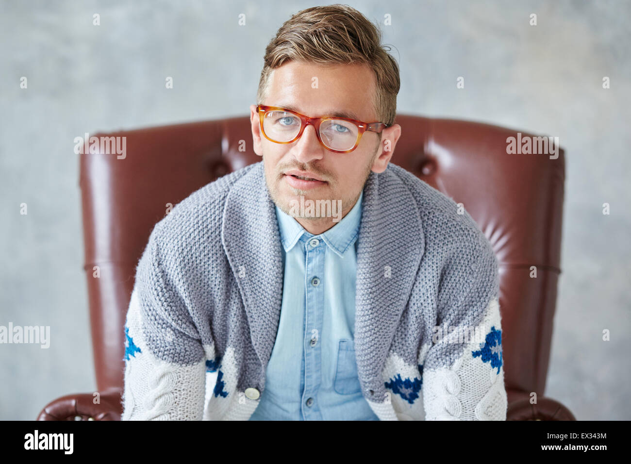 Portrait of a young intelligent man stares into the camera, good view ...