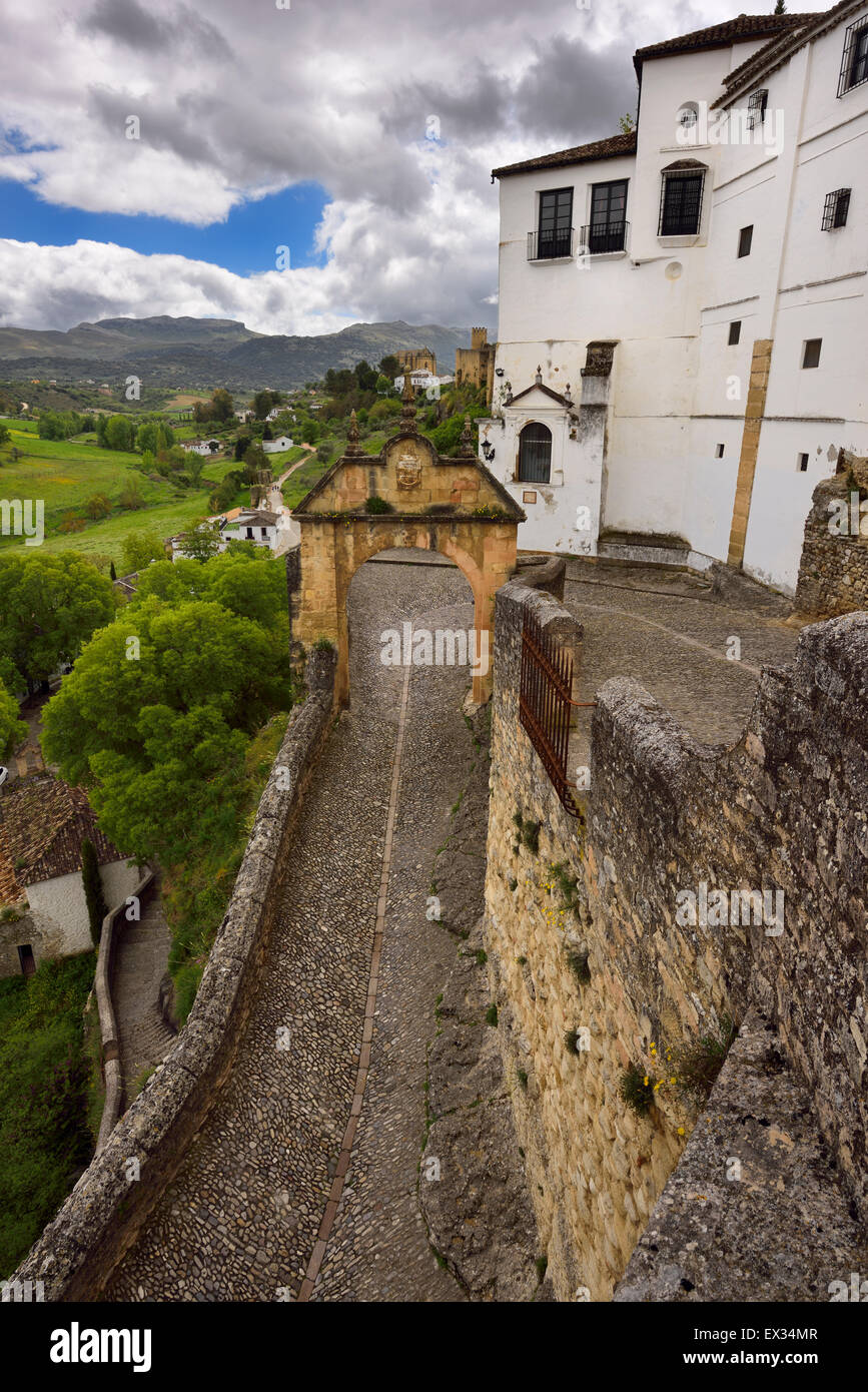 Arch of Felipe V with old stone path entrance to the city of Ronda ...