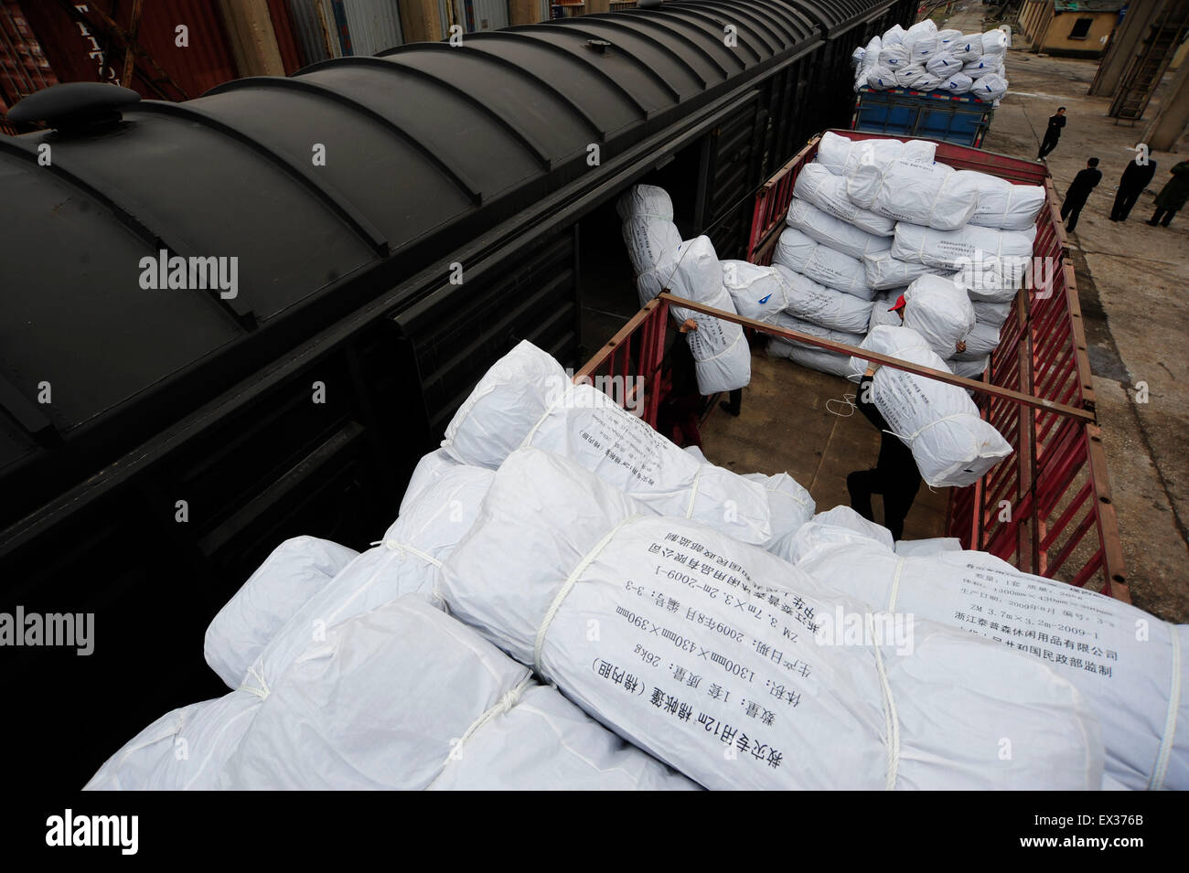 Tents are loaded on a train before aheading for the earthquake-hit ...