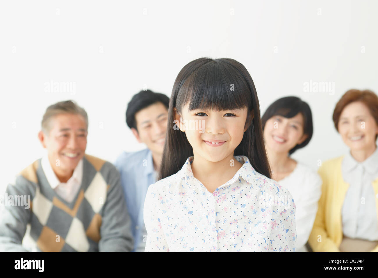 Three-generation Japanese family on the sofa in the living room Stock ...