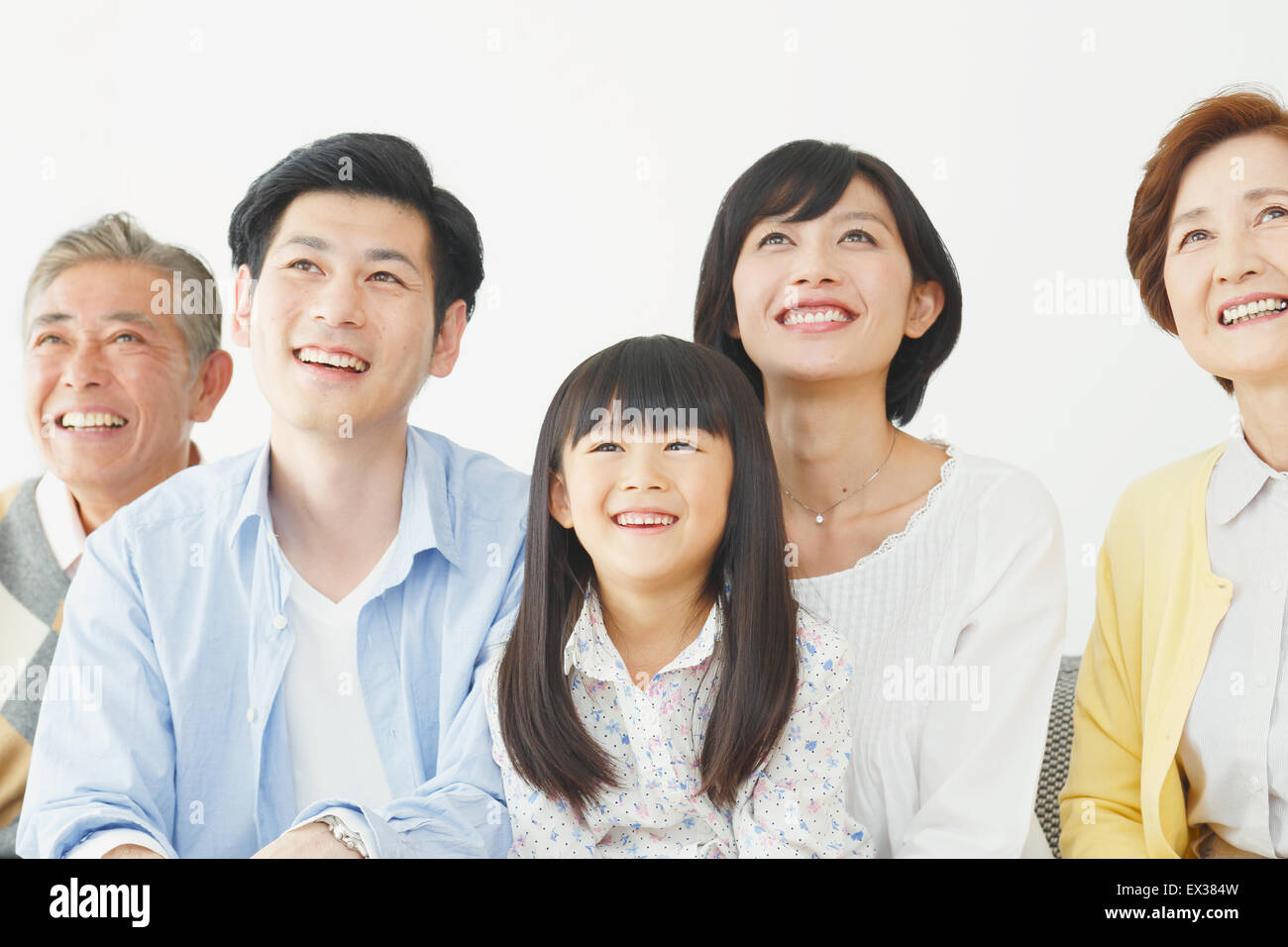 Three-generation Japanese family on the sofa in the living room Stock ...