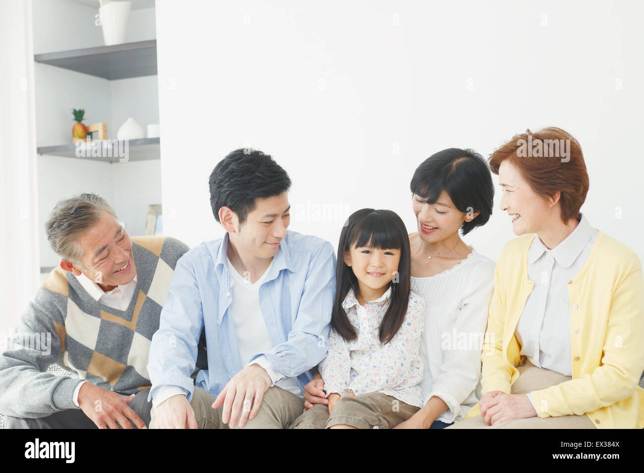 Family three sit on hi-res stock photography and images - Alamy