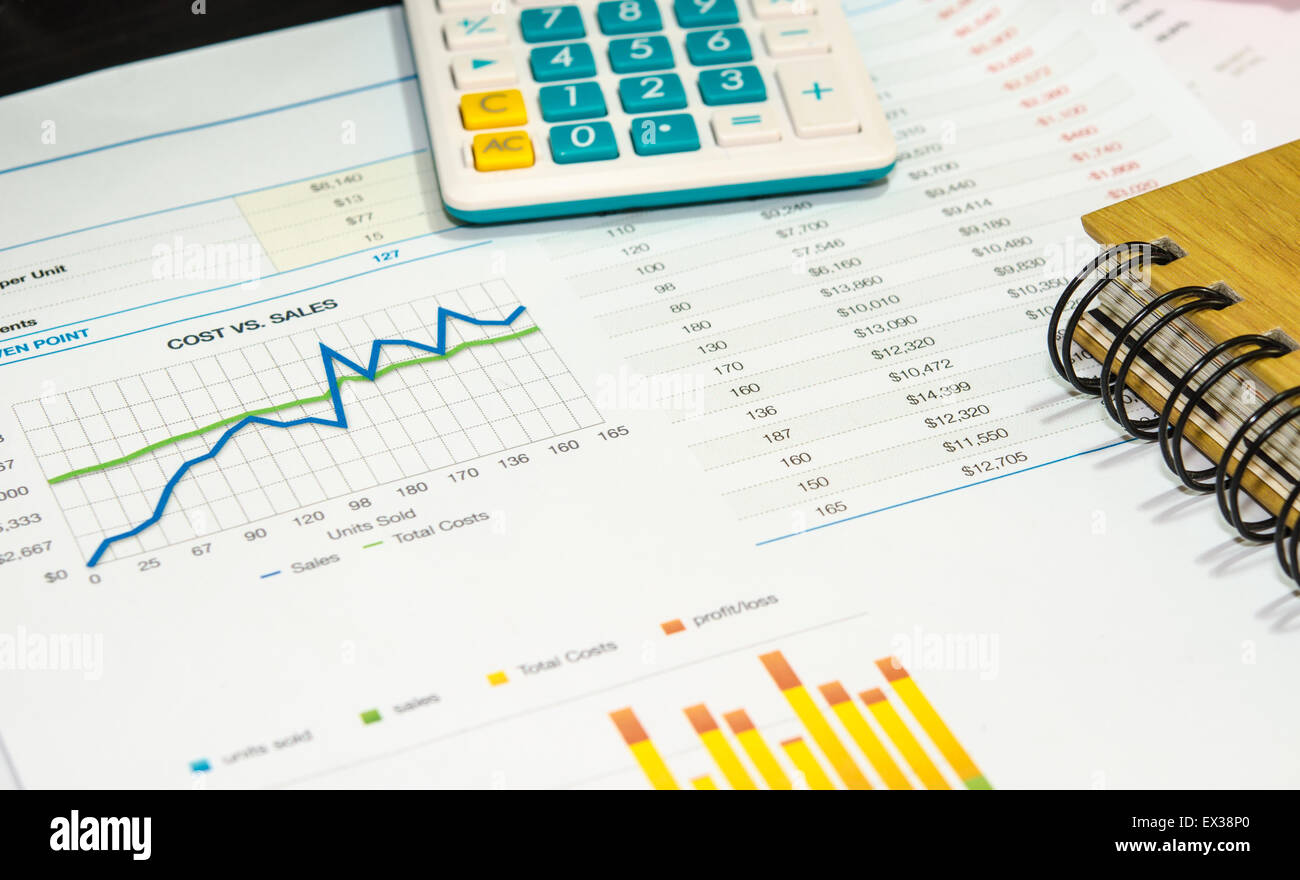 Financial paper charts and graphs on the table Stock Photo - Alamy