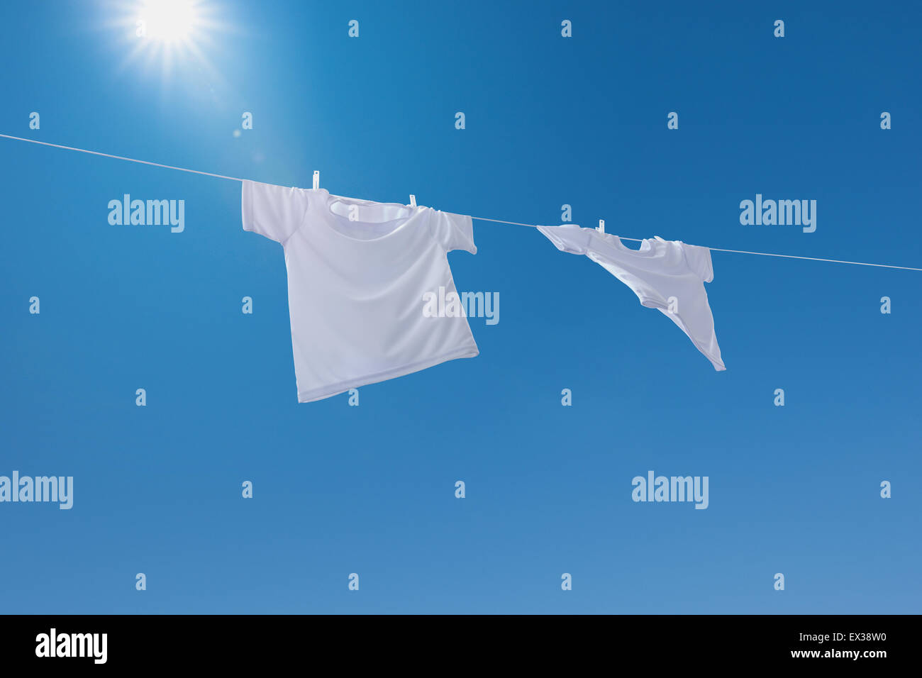 Laundry drying up on washing line Stock Photo - Alamy