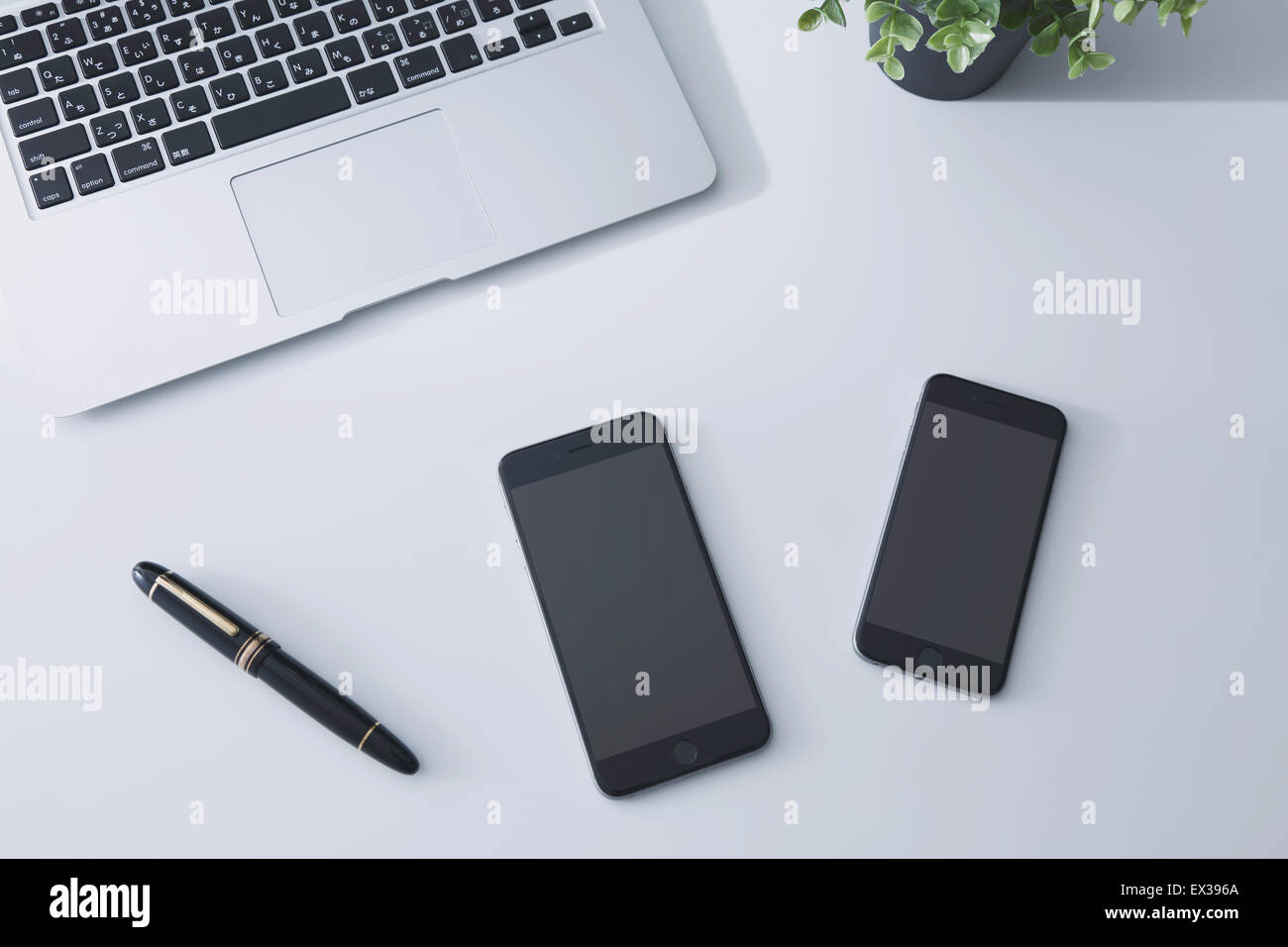 Smartphones and laptop Stock Photo - Alamy