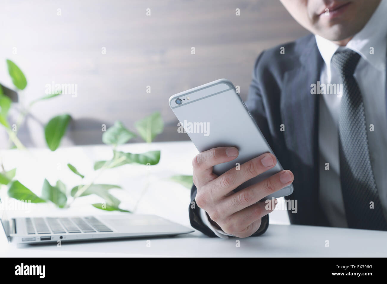 Japanese businessman working with large display smartphone Stock Photo ...