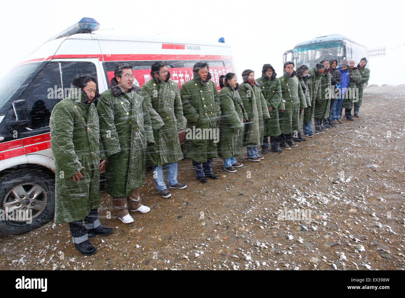 Passengers stand still to mourn the victims during the April 14 Yushu ...