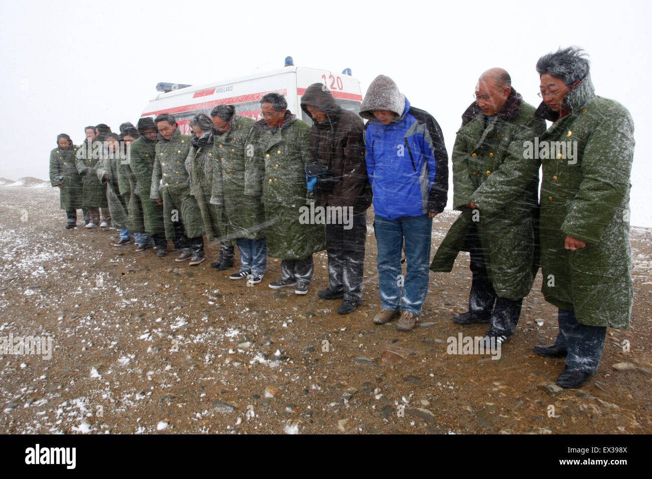 Passengers stand still to mourn the victims during the April 14 Yushu ...