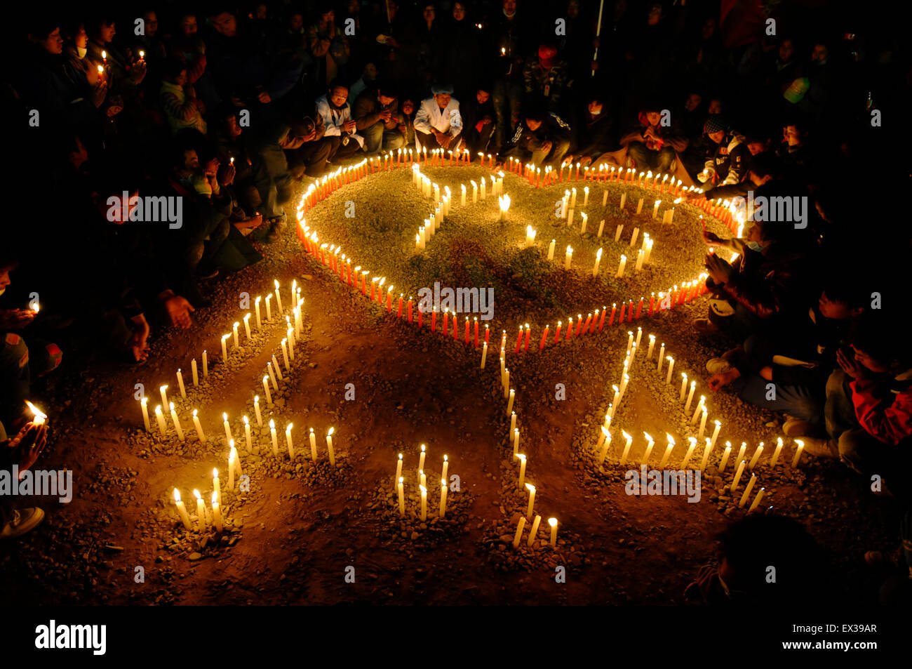 People mourn for victims of the April 14 Yushu Earthquake at a square ...