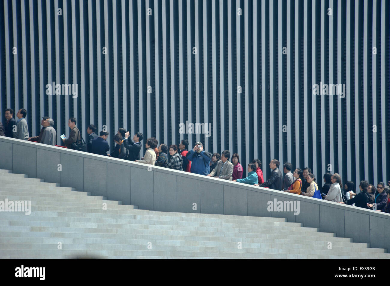 Visitors wait in line to enter ouside of China pavilion at the Shanghai ...
