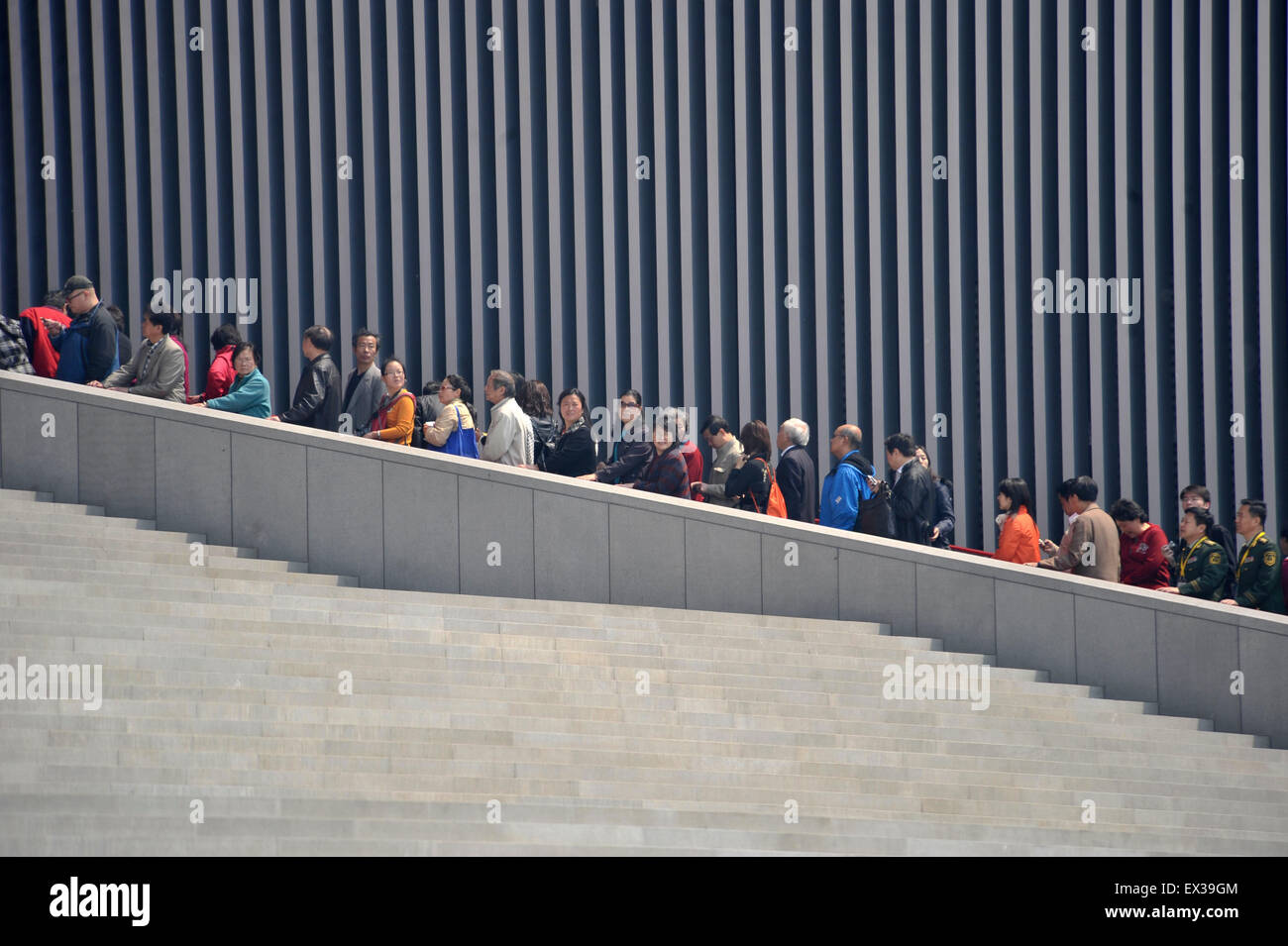 Visitors wait in line to enter ouside of China pavilion at the Shanghai ...