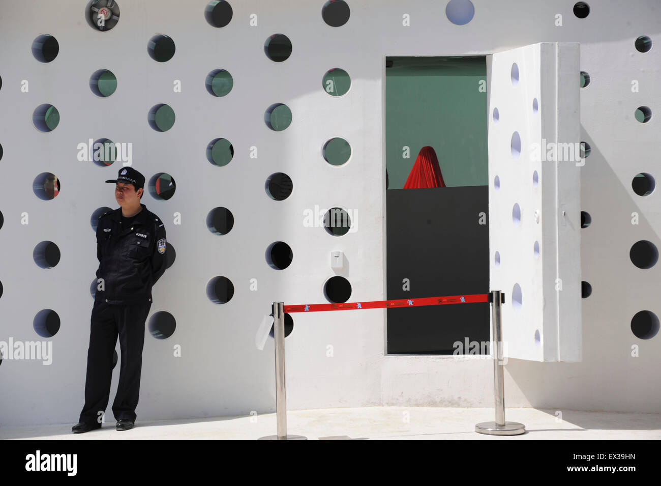 A security staff guards outside the Danish pavilion Denmark's iconic ...