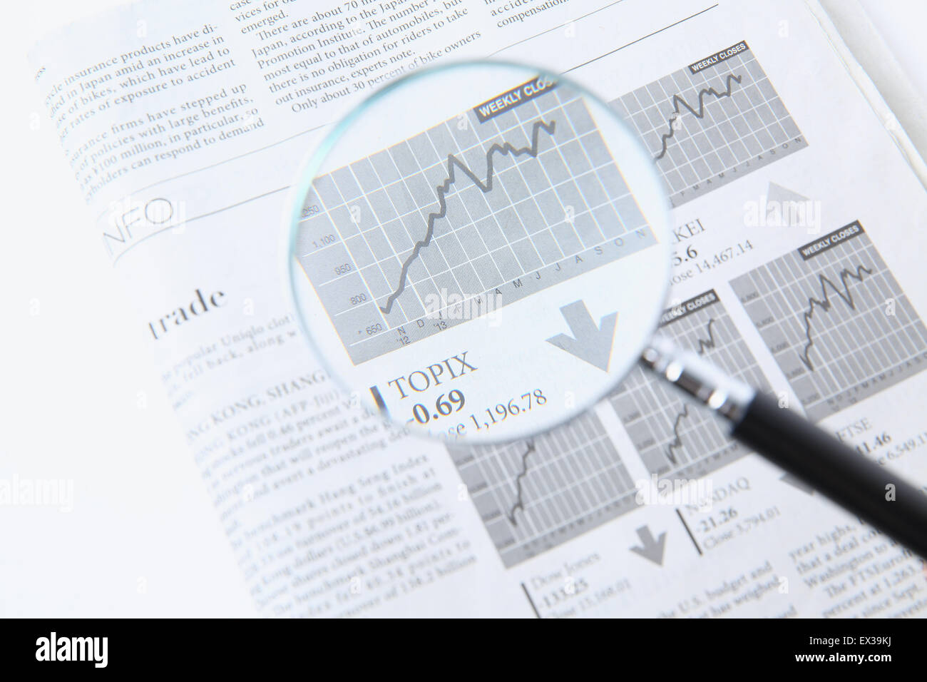 Newspaper and magnifying glass Stock Photo - Alamy