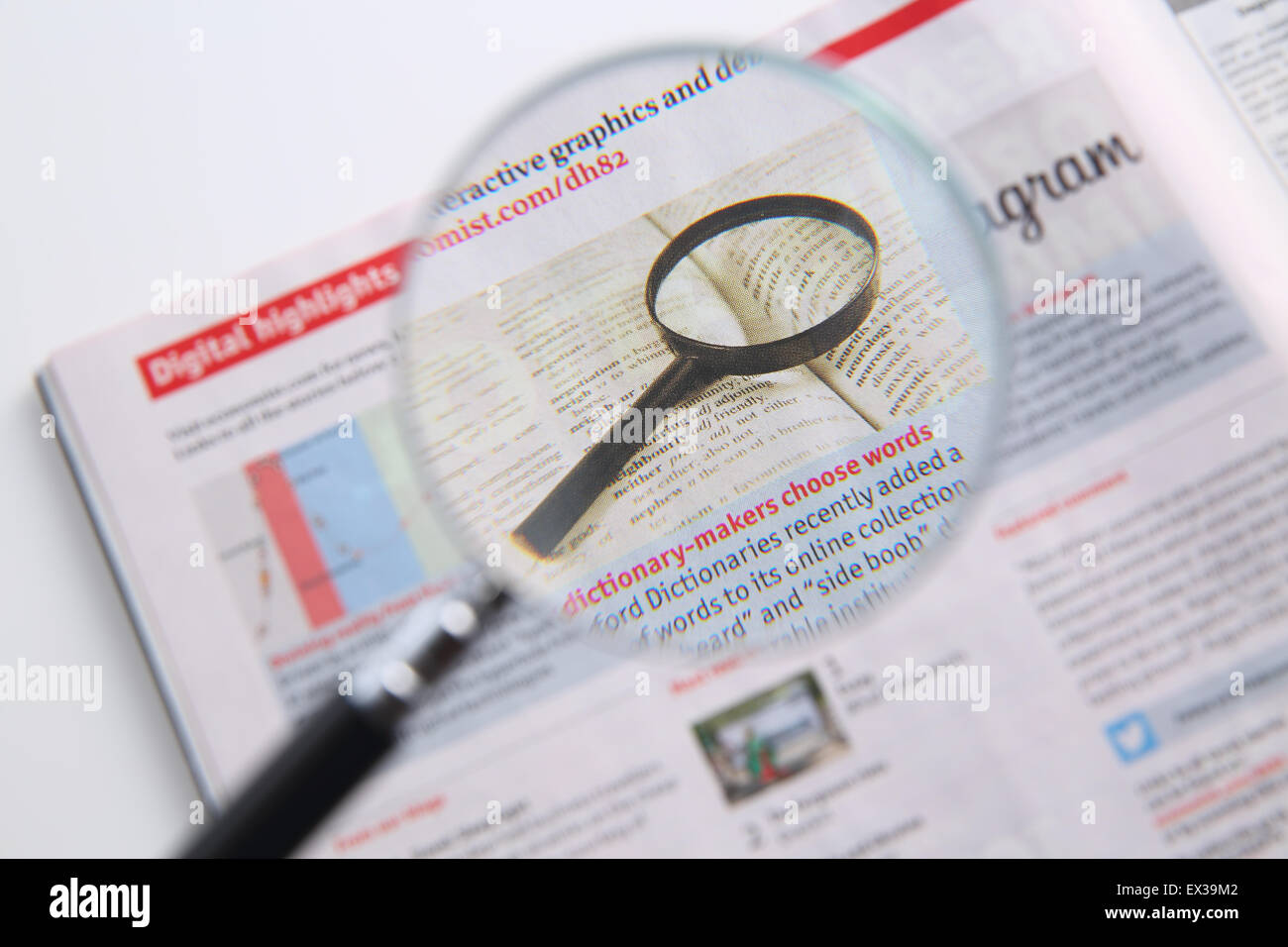 Newspaper and magnifying glass Stock Photo - Alamy