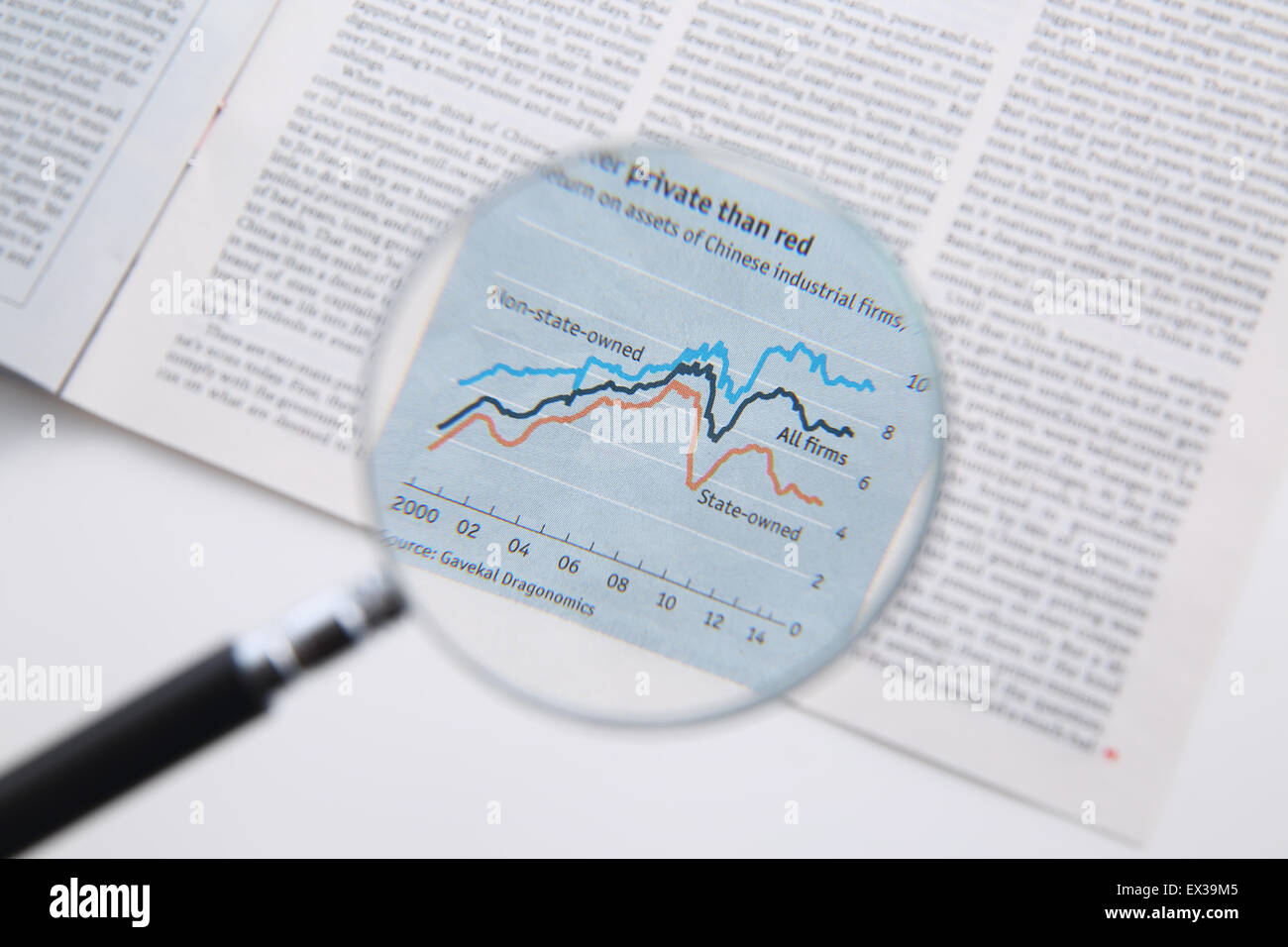 Newspaper and magnifying glass Stock Photo - Alamy