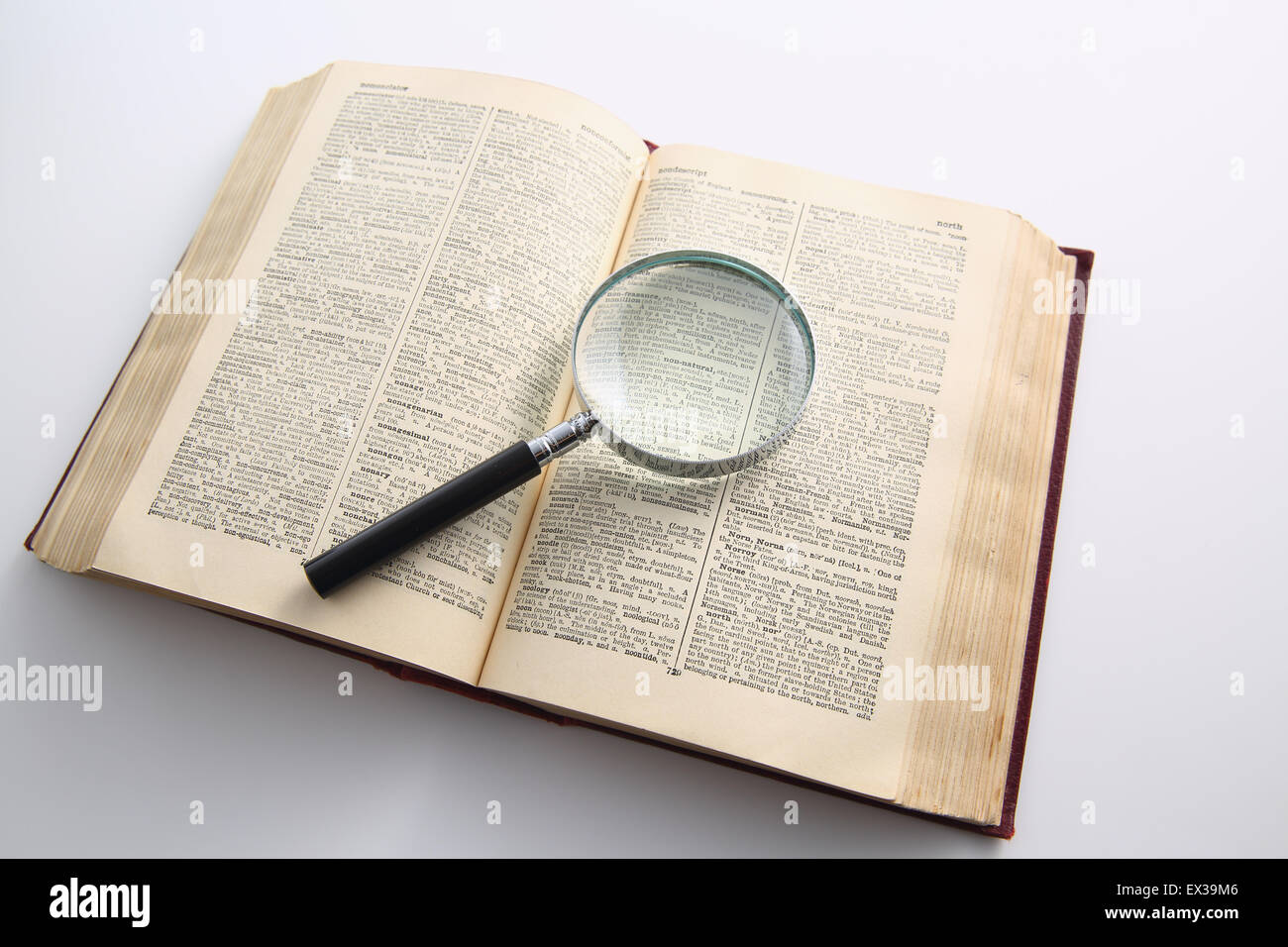Dictionary and magnifying glass Stock Photo - Alamy Dictionary and magnifying glass Stock Photo - Alamy