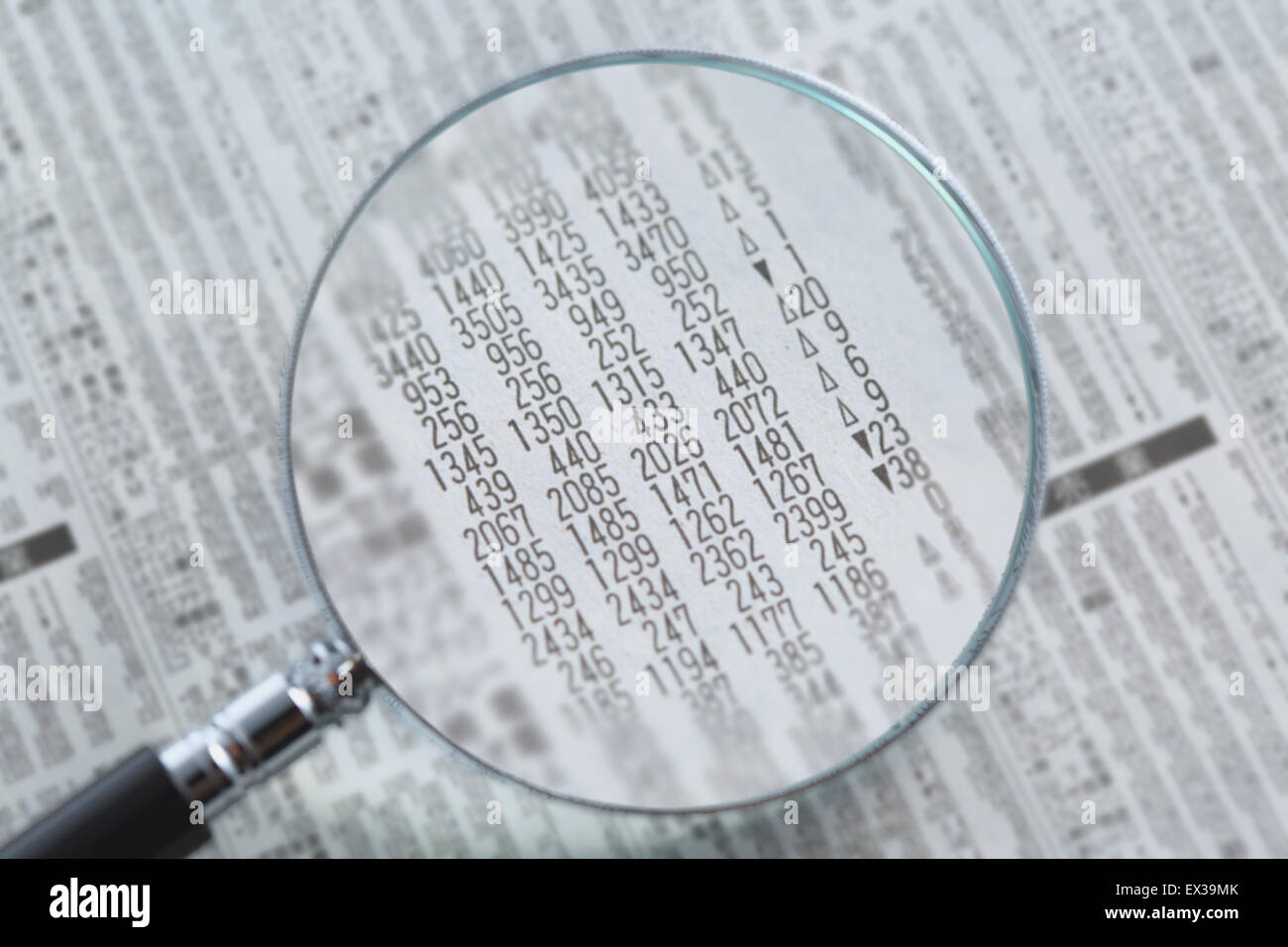 Newspaper and magnifying glass Stock Photo - Alamy
