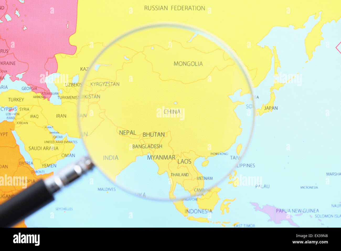 World map and magnifying glass Stock Photo - Alamy