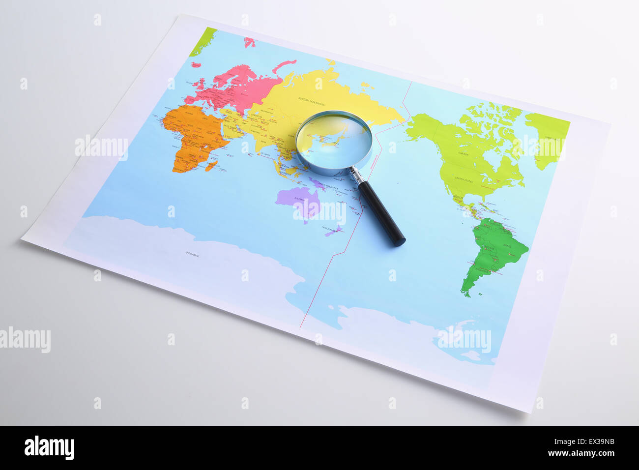 World map and magnifying glass Stock Photo - Alamy
