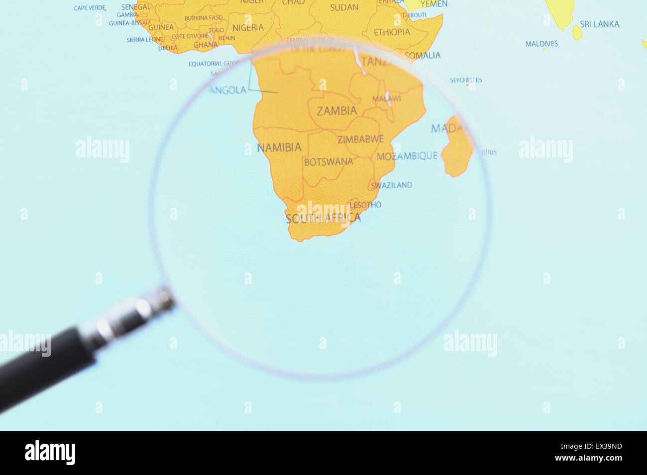 World map and magnifying glass Stock Photo - Alamy