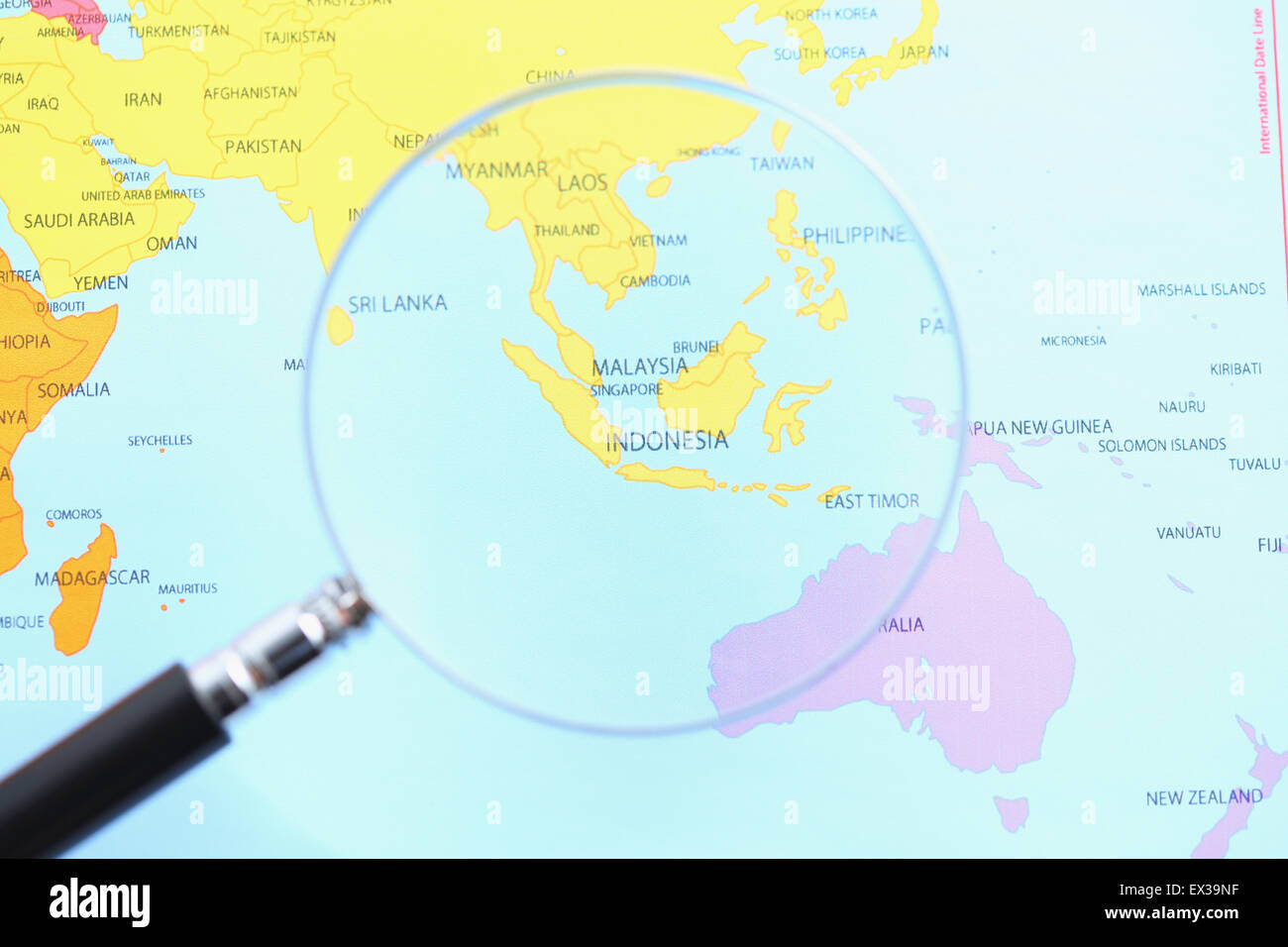 World map and magnifying glass Stock Photo - Alamy