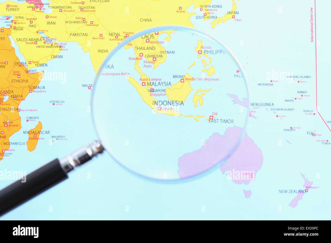 World map and magnifying glass Stock Photo - Alamy