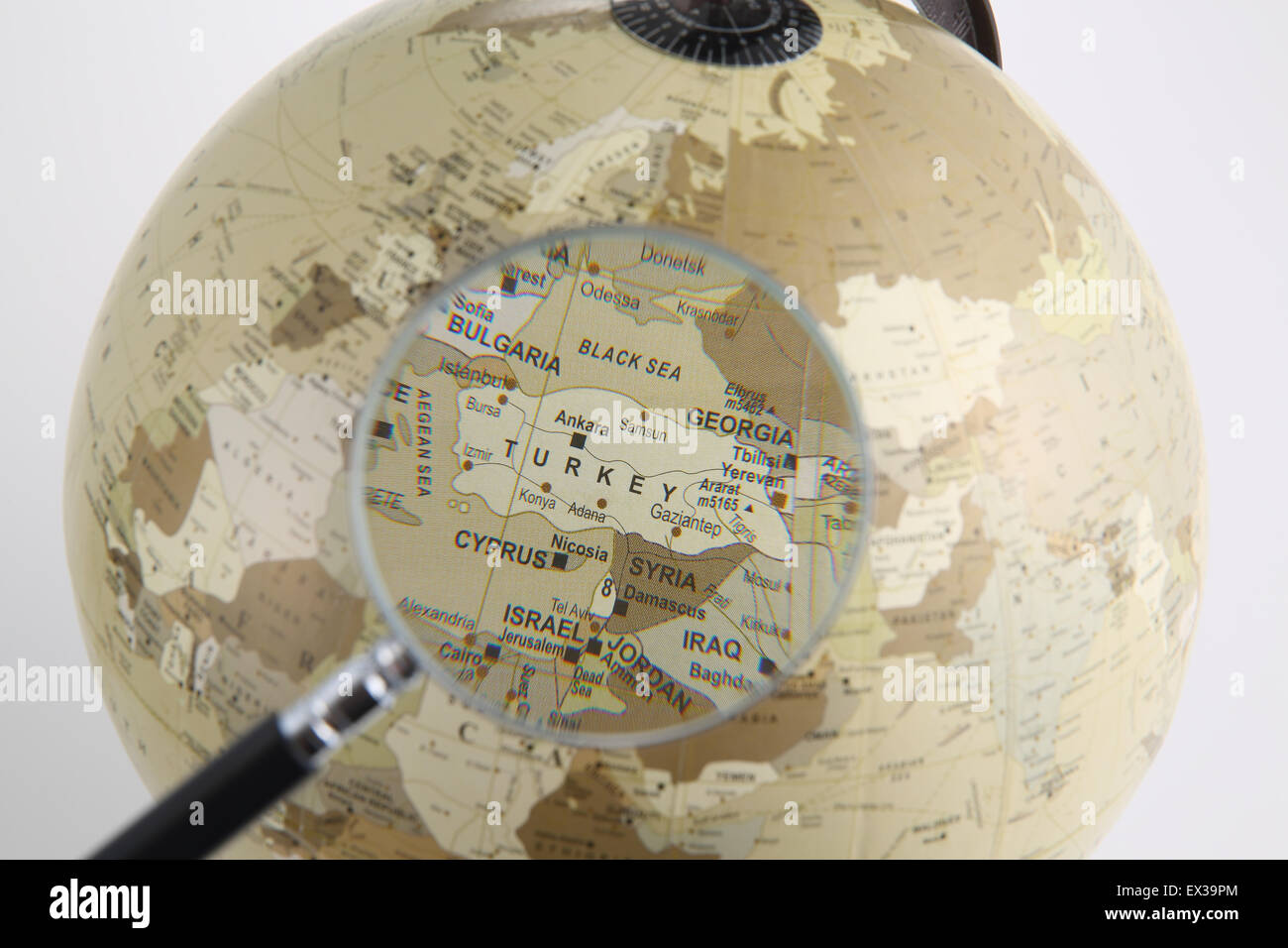 World globe and magnifying glass Stock Photo - Alamy