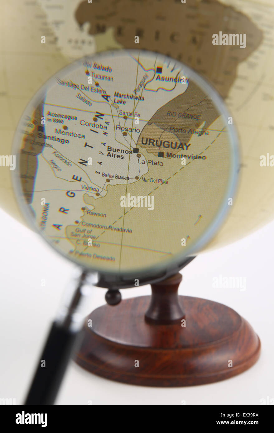 World globe and magnifying glass Stock Photo - Alamy