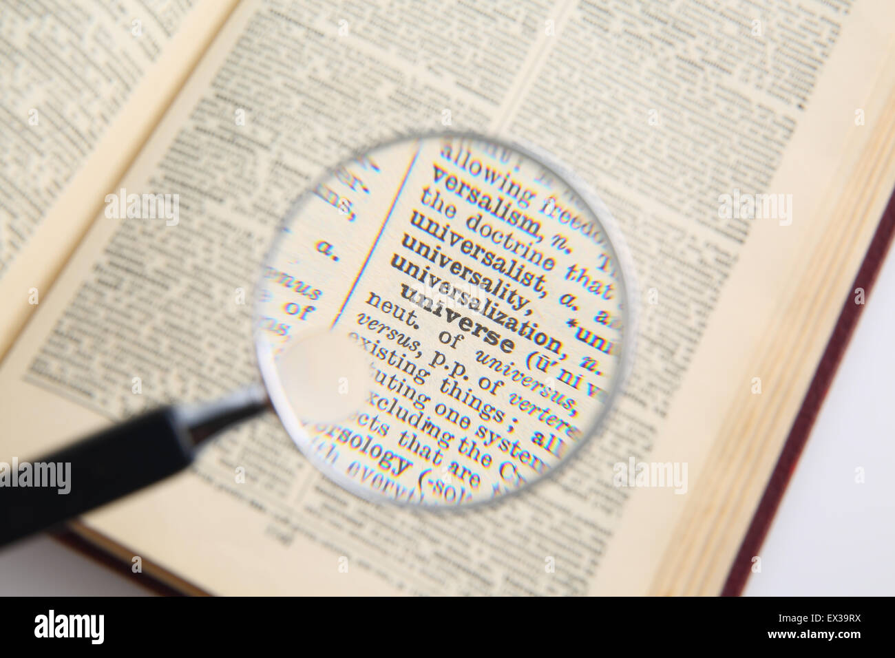 Dictionary and magnifying glass Stock Photo - Alamy