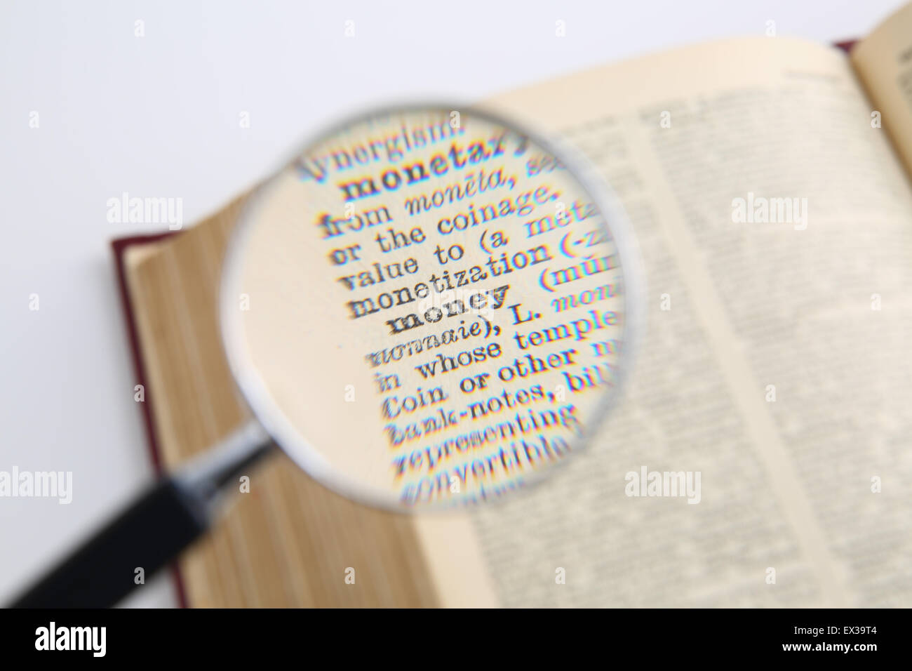Dictionary and magnifying glass Stock Photo - Alamy