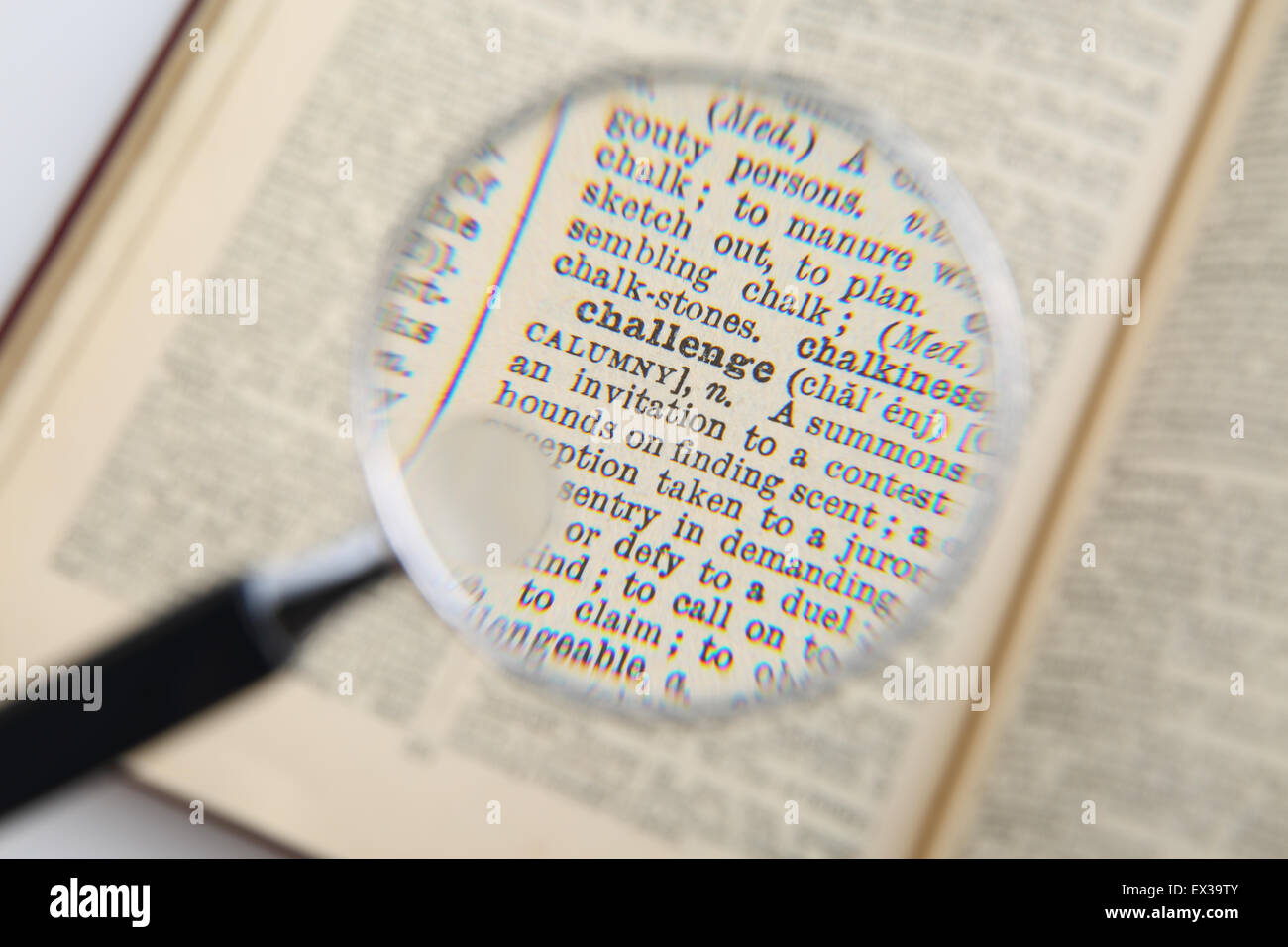 Dictionary and magnifying glass Stock Photo - Alamy