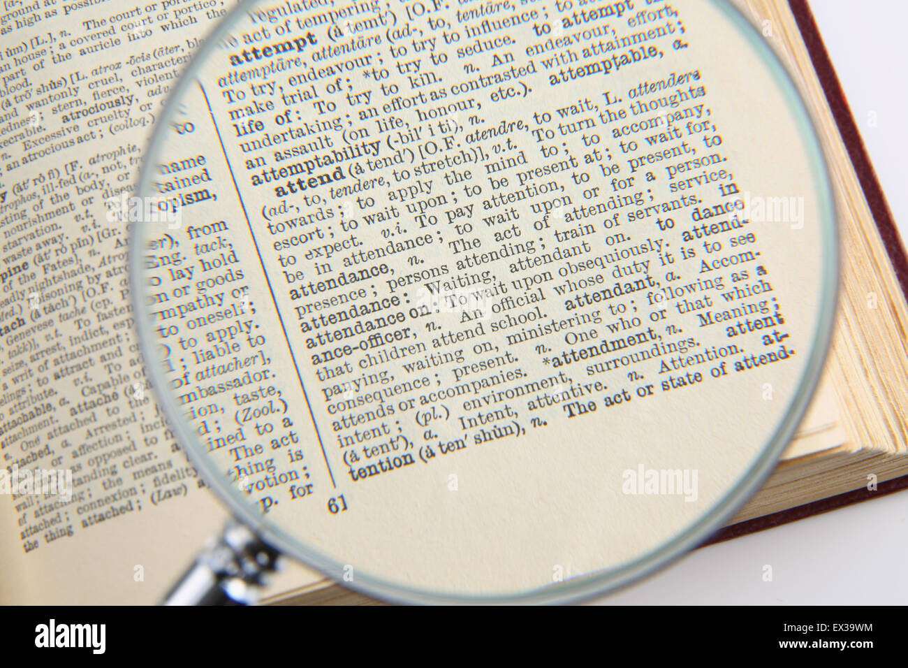 Dictionary and magnifying glass Stock Photo - Alamy