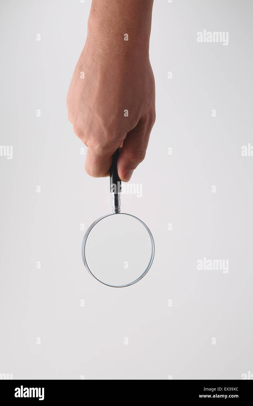 Adult holding magnifying glass hi-res stock photography and images - Alamy
