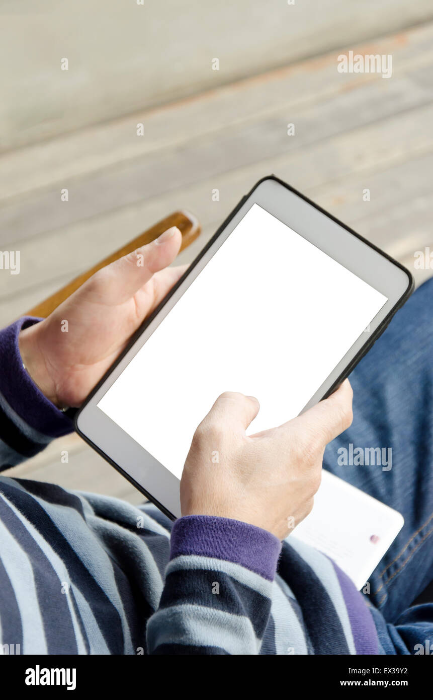 Close up hands multitasking man using tablet Stock Photo - Alamy