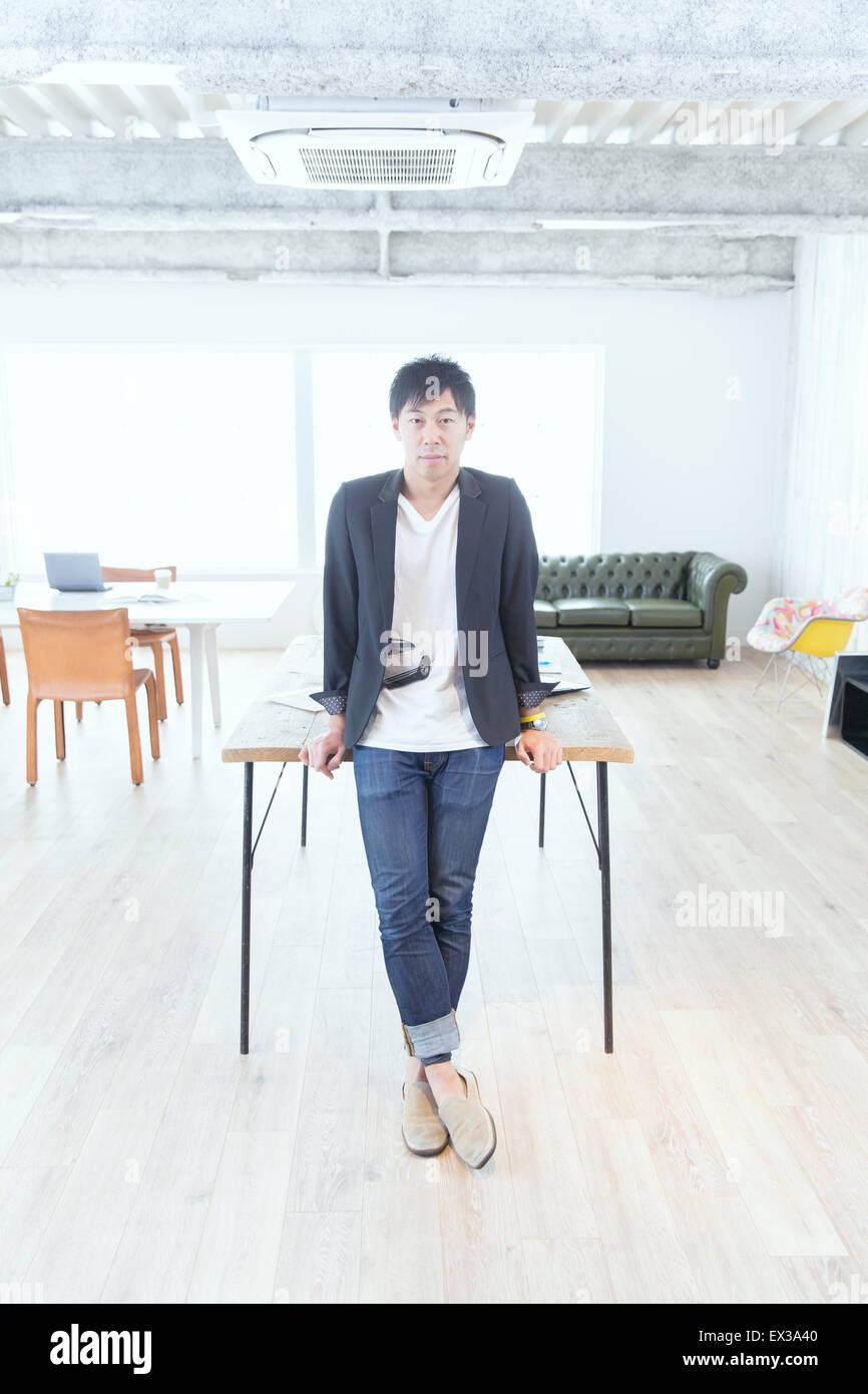 Japanese man working in modern office Stock Photo - Alamy