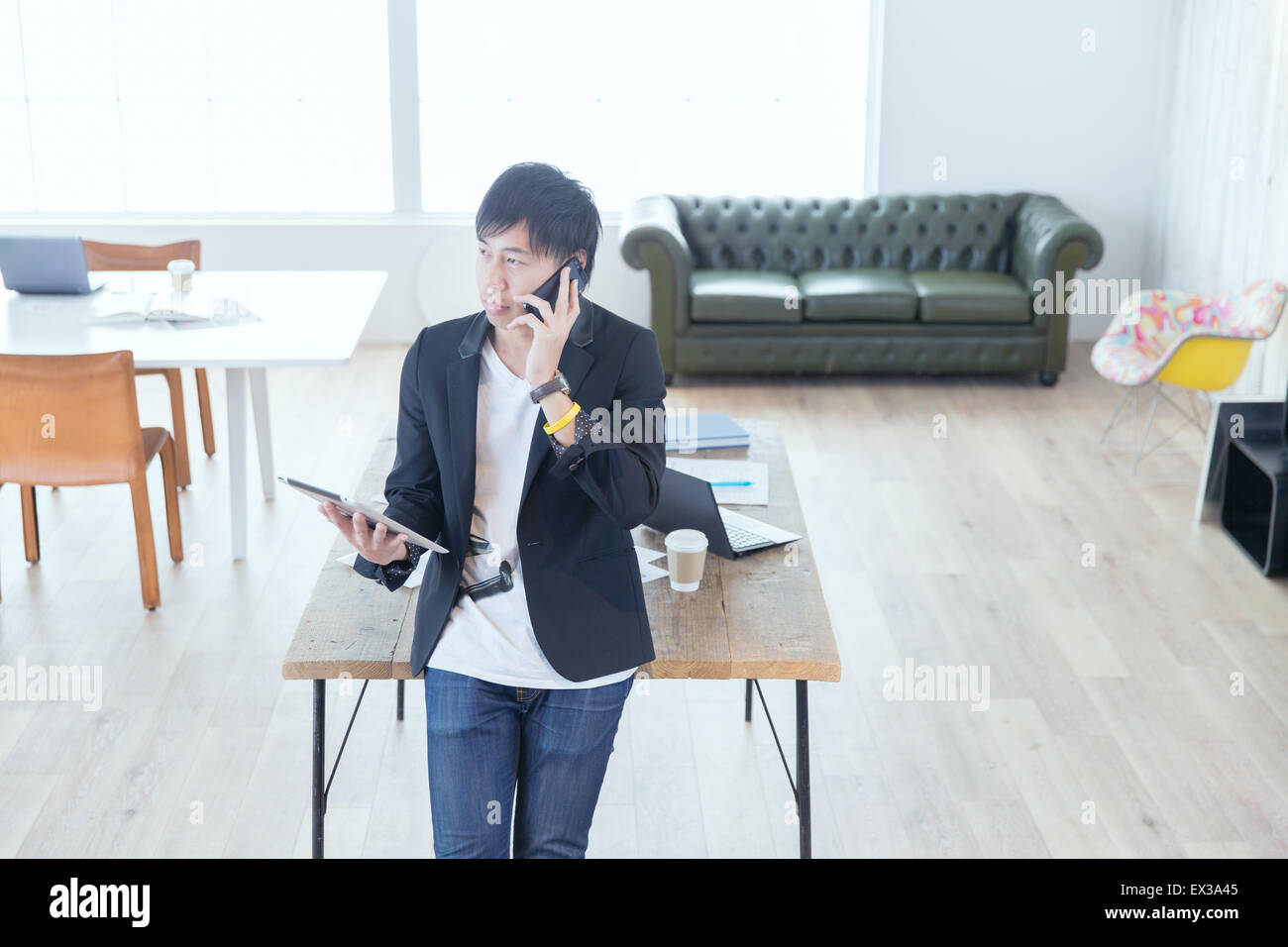 Japanese man working in modern office Stock Photo - Alamy