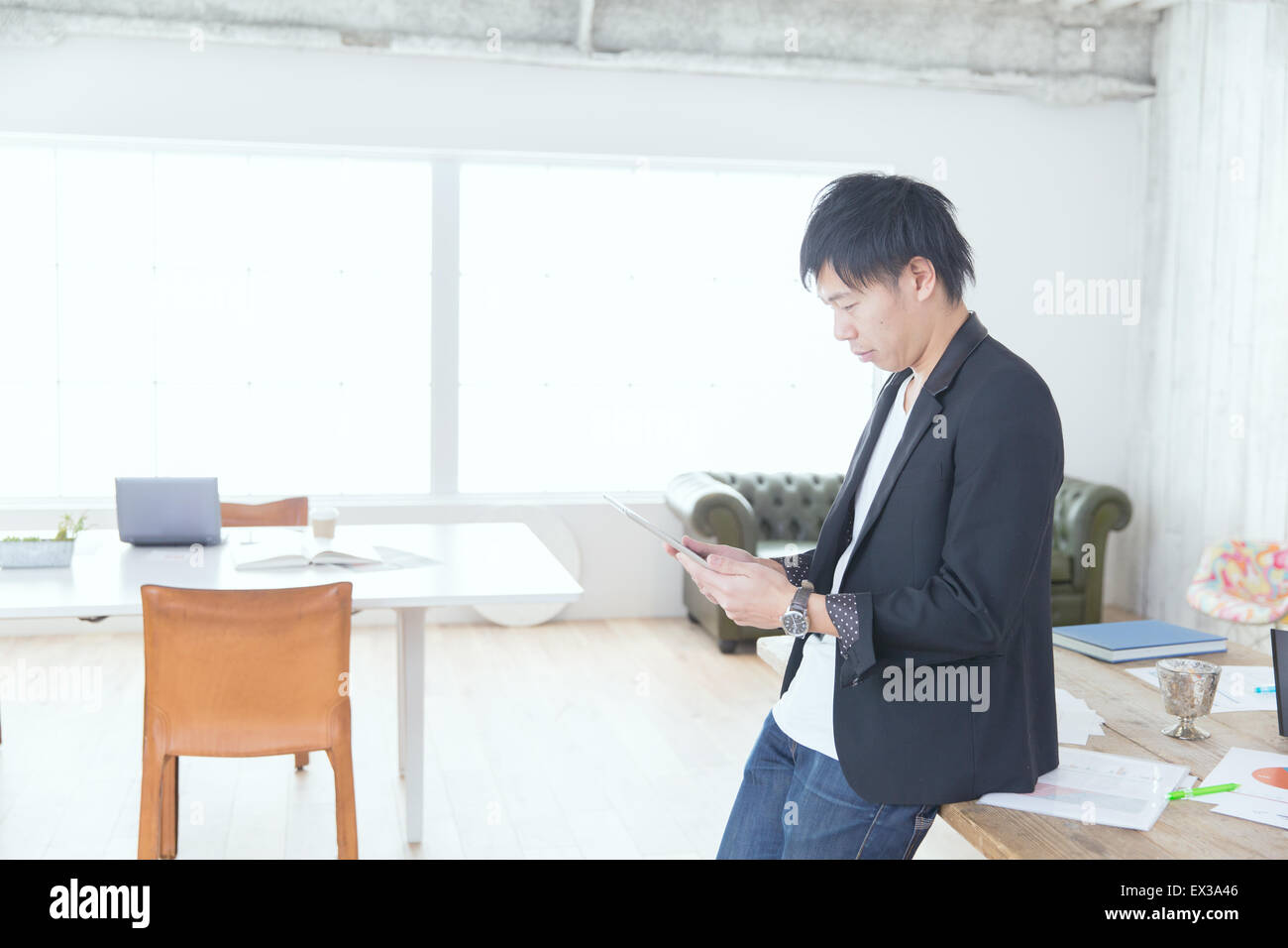 Japanese man working in modern office Stock Photo - Alamy