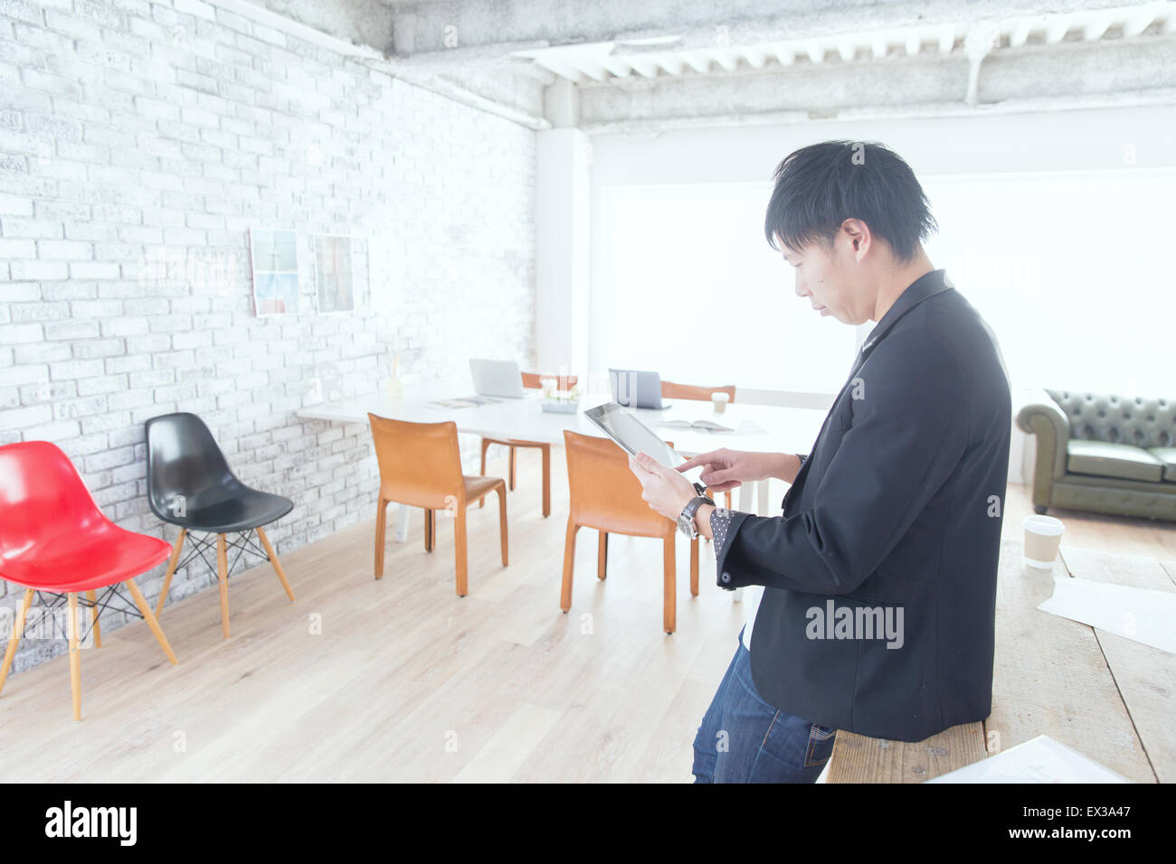 Japanese man working in modern office Stock Photo - Alamy
